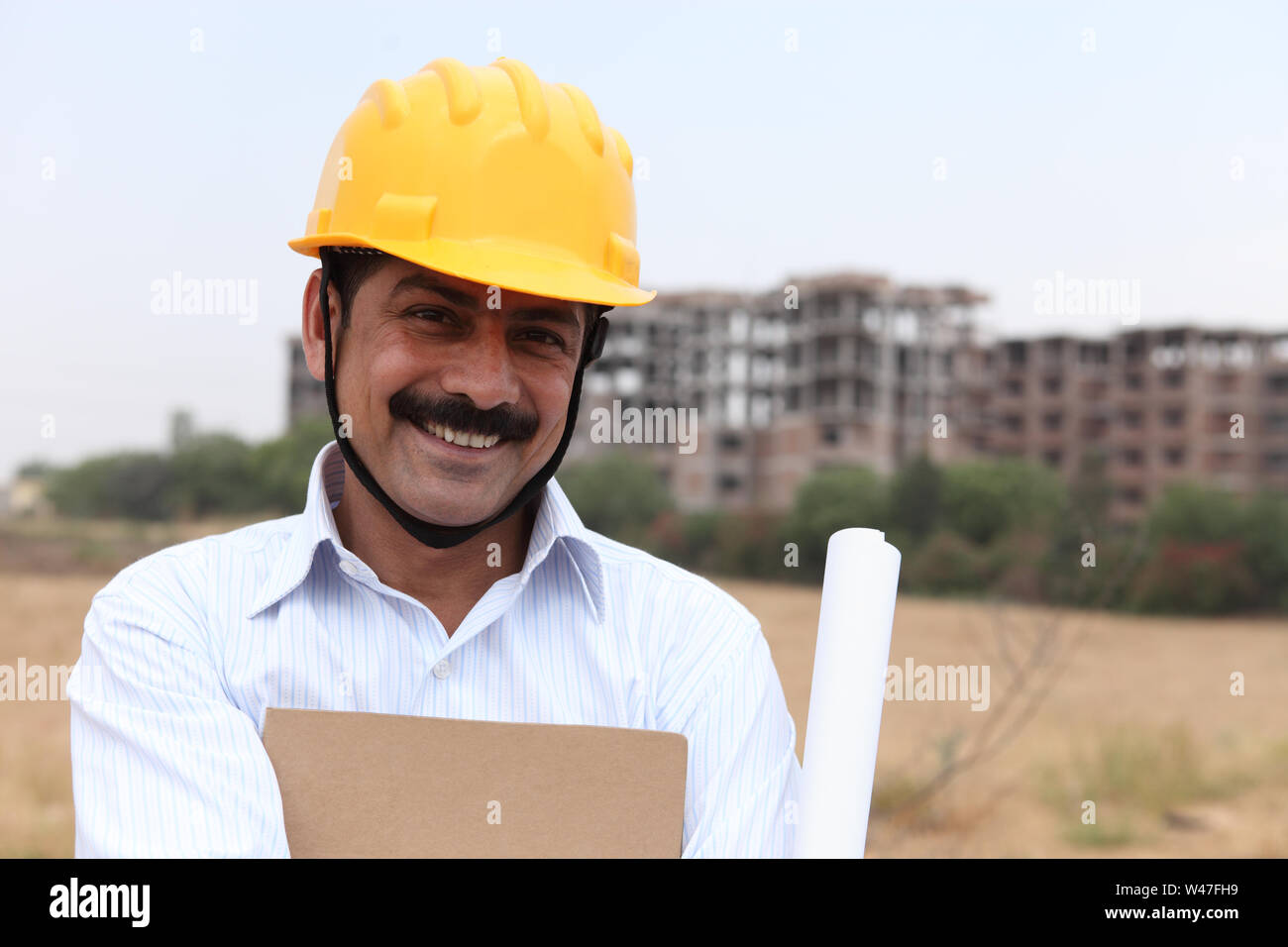 Portrait of an architect smiling Stock Photo - Alamy