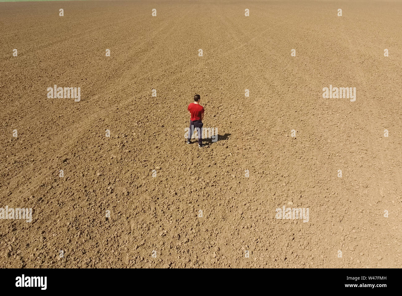 A man pisses in the open field. Urination in nature Stock Photo - Alamy