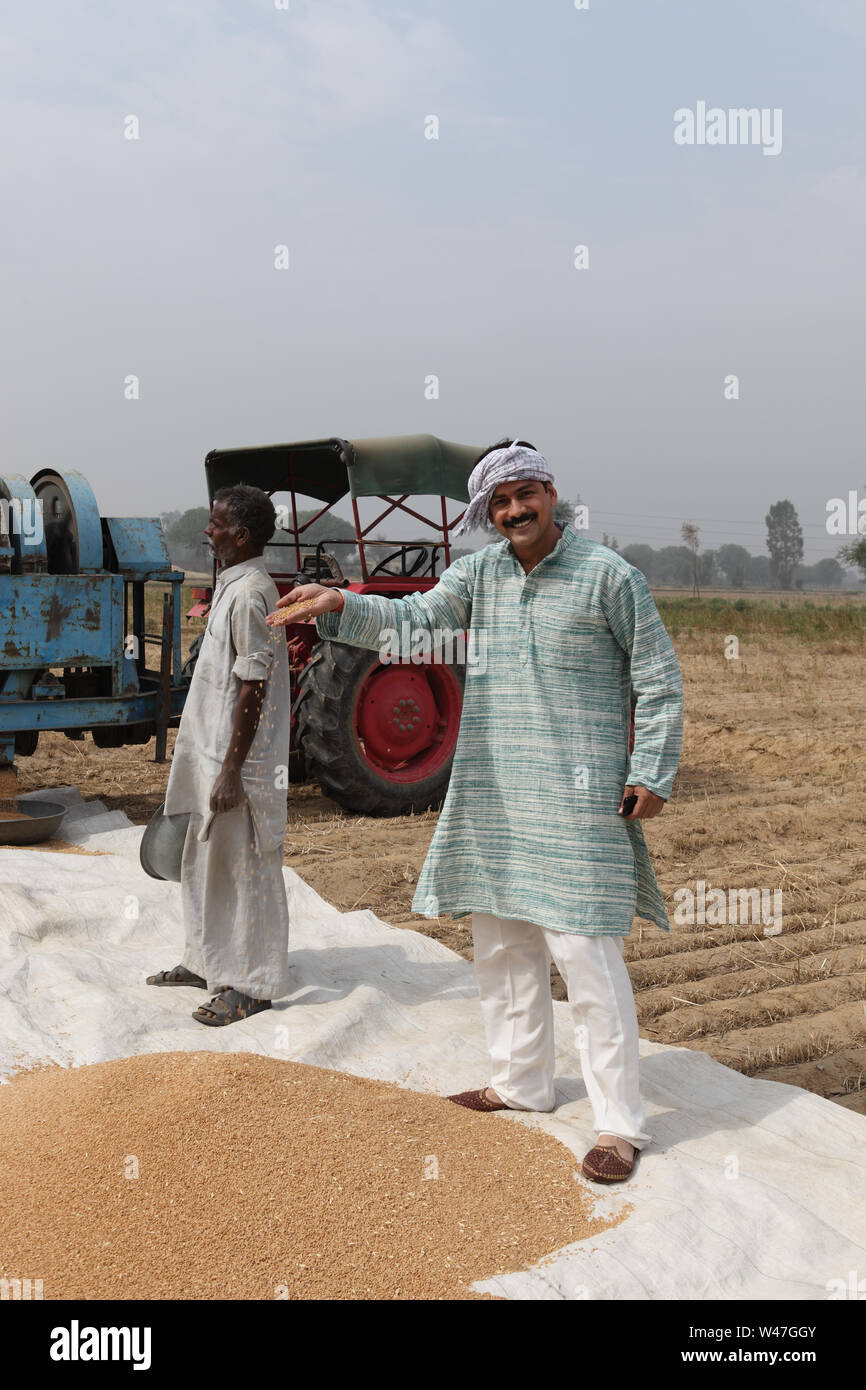 Farmer working in a field Stock Photo - Alamy