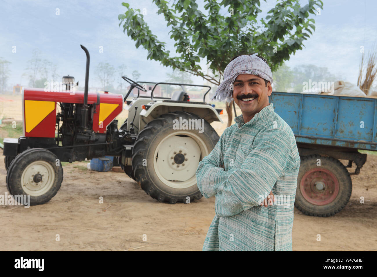 Portrait of a farmer smiling Stock Photo - Alamy