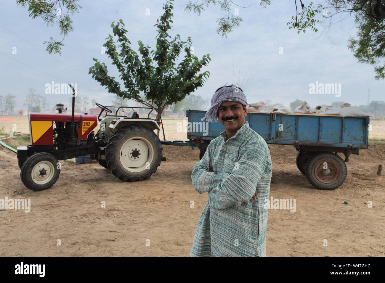 Portrait of a farmer smiling Stock Photo - Alamy