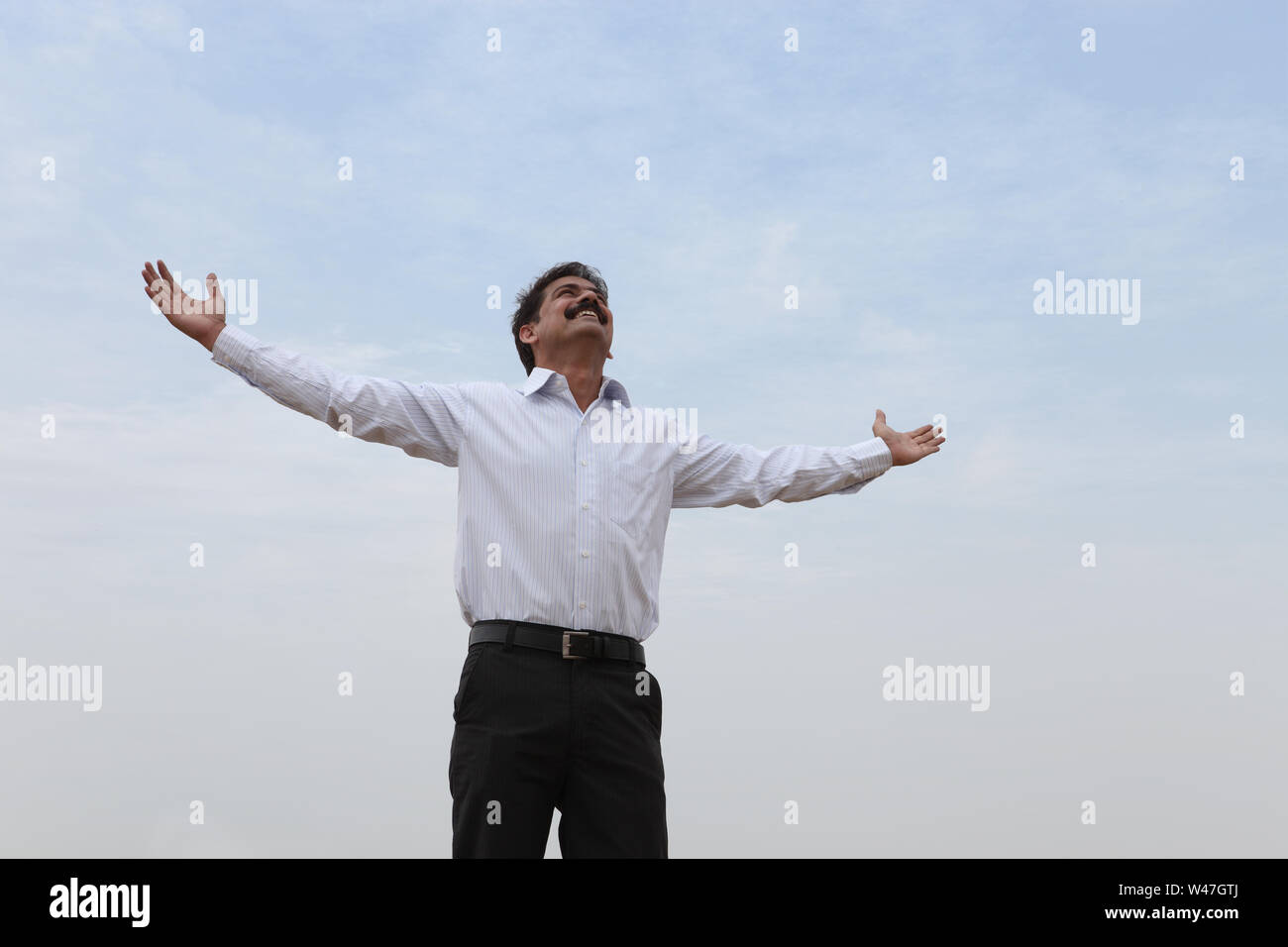 Businessman outstretching arms hi-res stock photography and images - Alamy