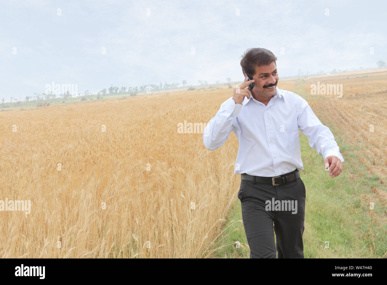 Rural indian man in office hi-res stock photography and images - Alamy