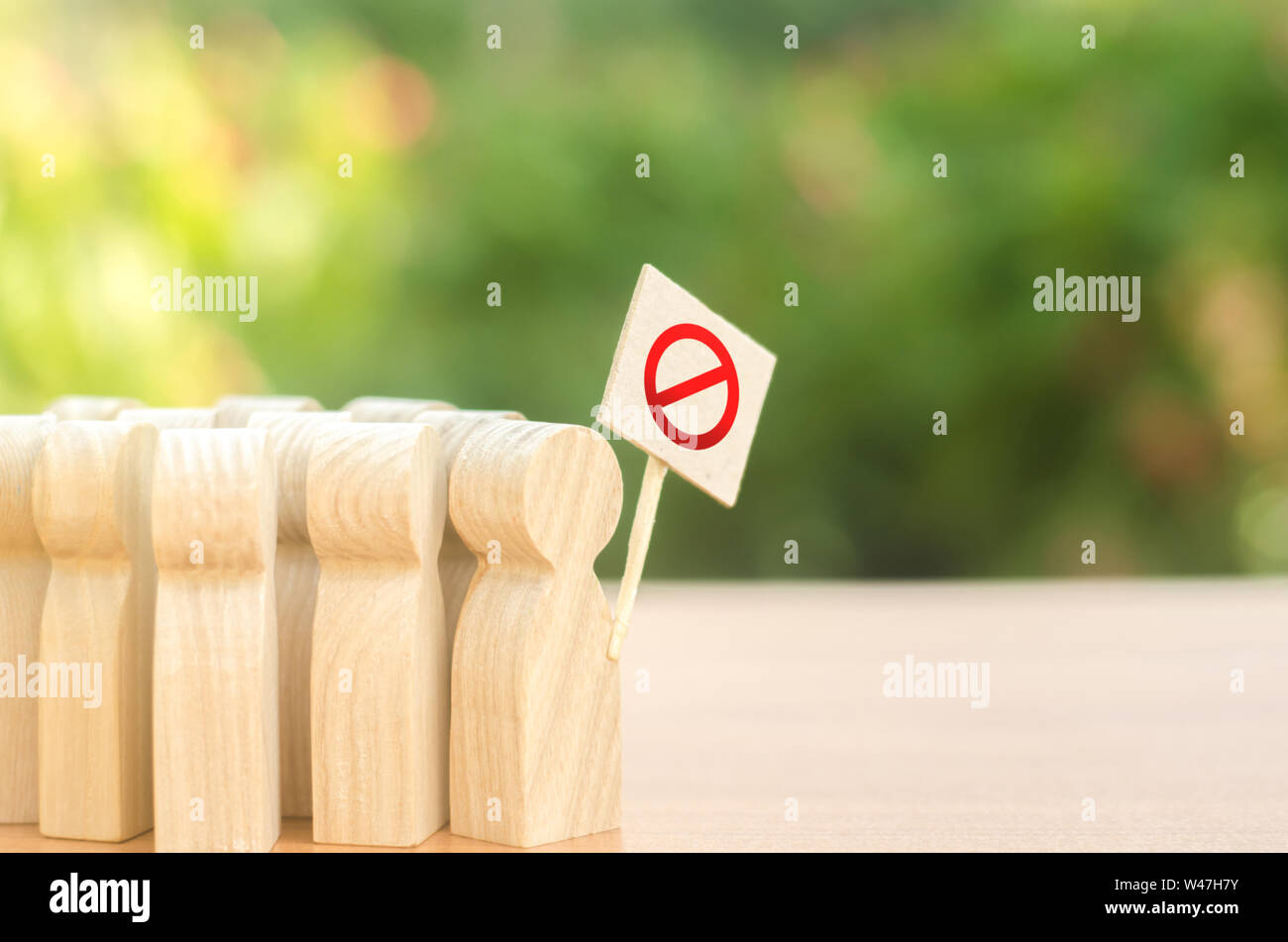 A crowd of people with posters protesting. An angry mob of wooden ...