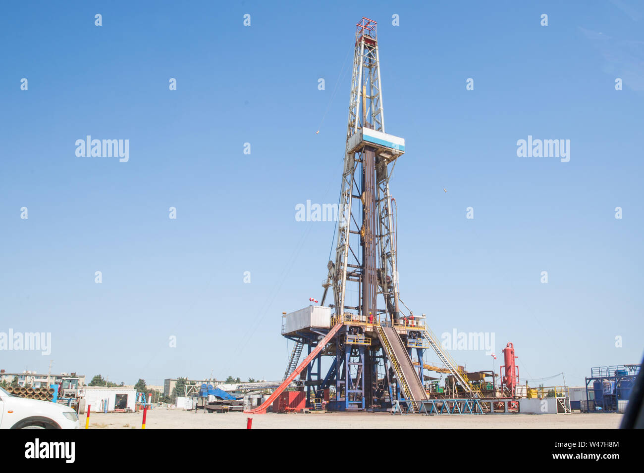 Oil and gas drilling rig onshore dessert with dramatic cloudscape ...