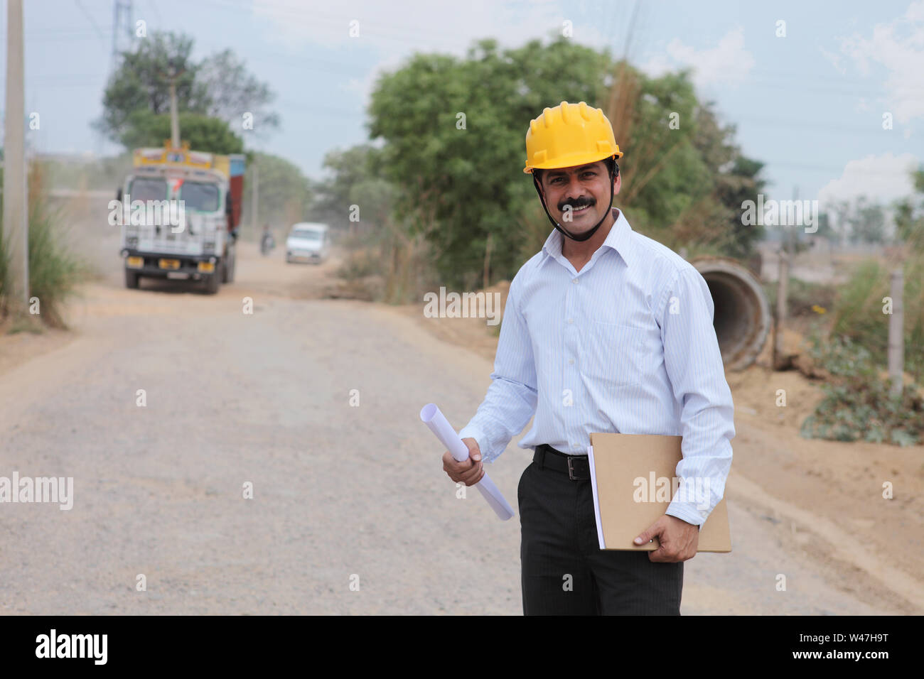 Indian male engineer inspecting site hi-res stock photography and ...