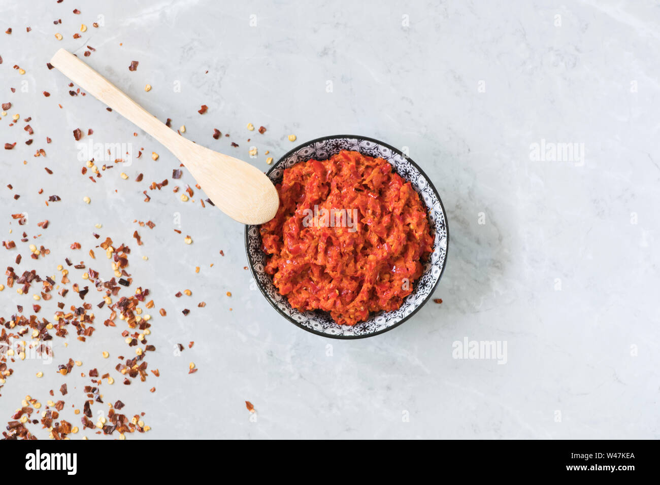 vTraditional Maghrebi hot chili pepper sauce harissa on a grey marble ...