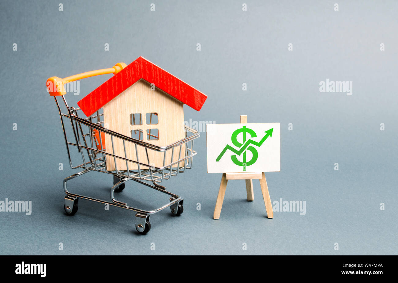 A red roof house in a trading cart and green arrow up on a stand ...