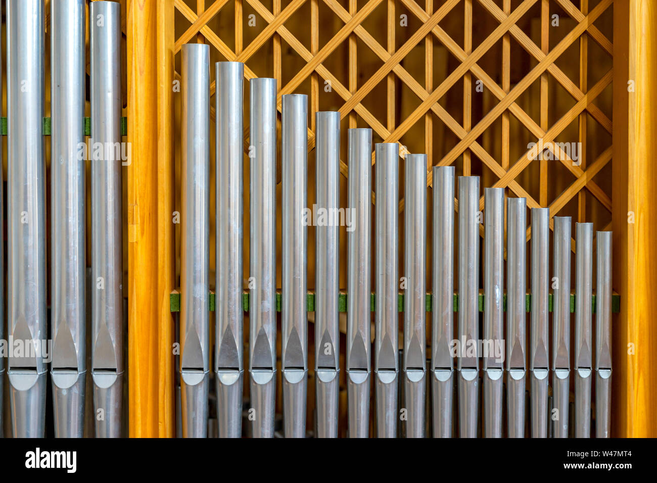High-quality silver organ pipes in golden frame, background, symbol ...