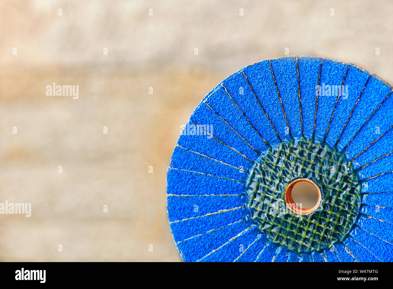 A part of a petal grinding wheel of blue color for sanding wood and ...