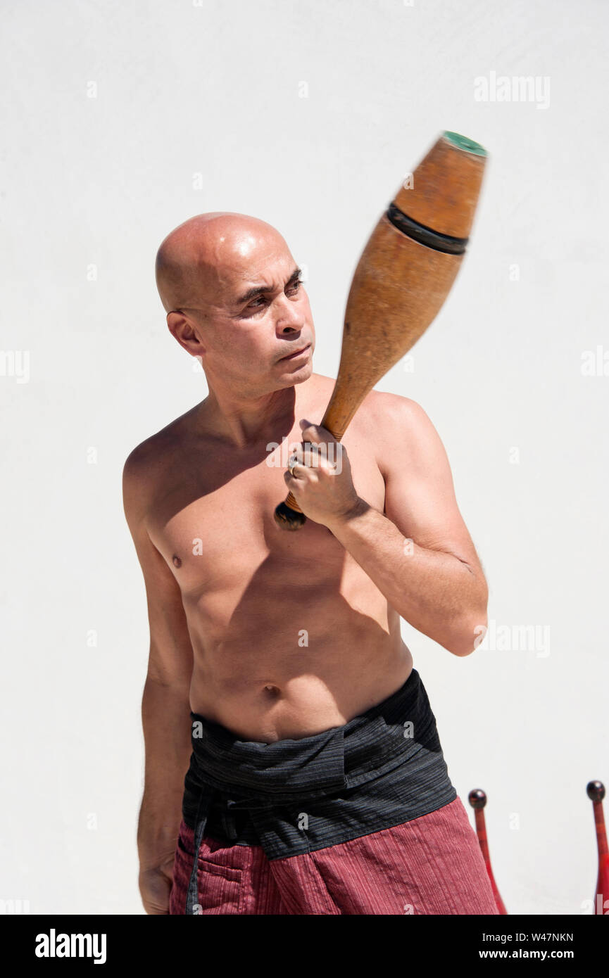 Man practicing with classic Indian Clubs a traditional exercise from ...