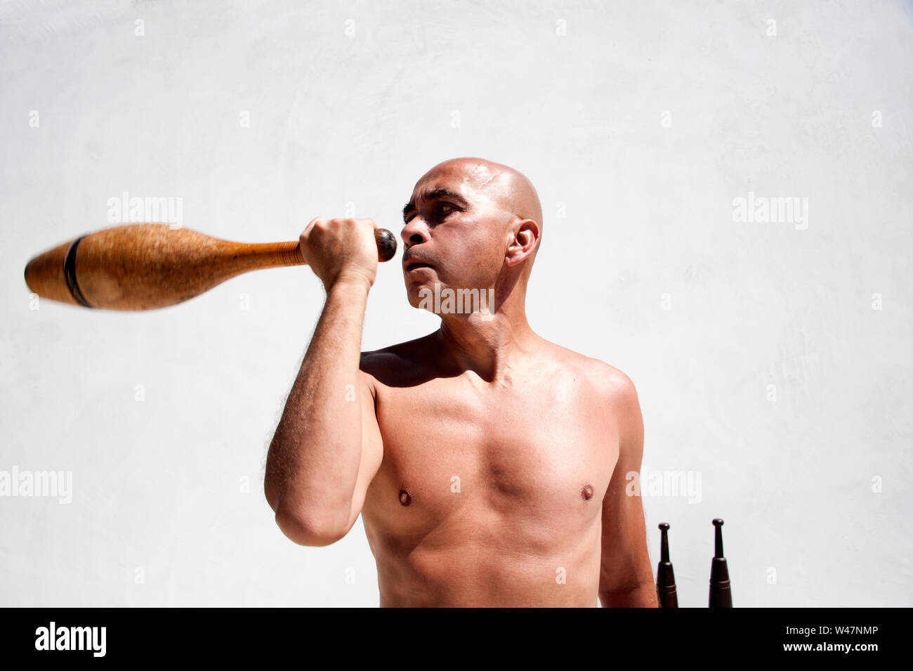 Man practicing with classic Indian Clubs a traditional exercise from ...