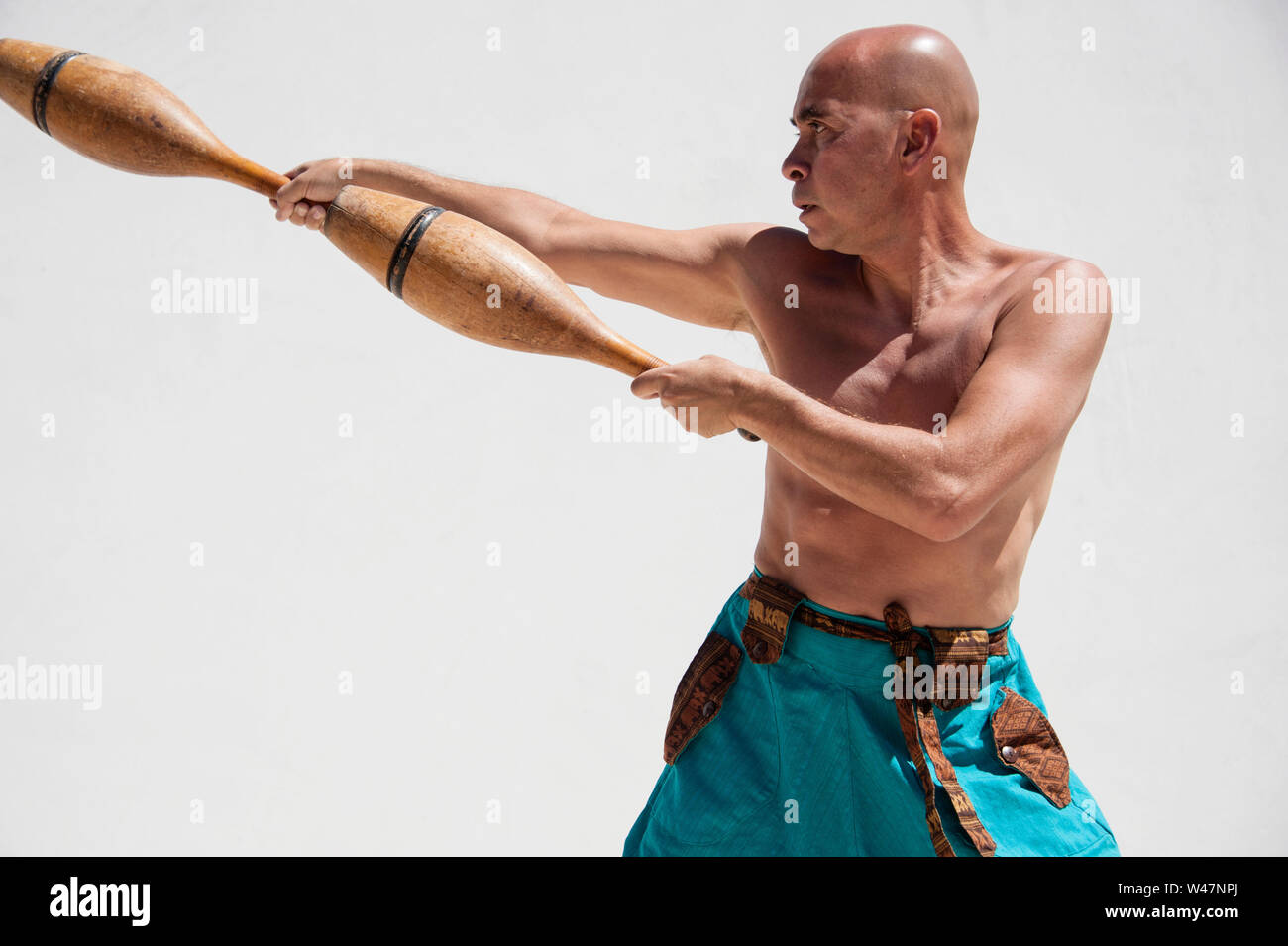 Man practicing with classic Indian Clubs a traditional exercise from ...