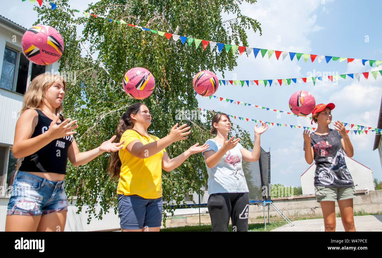 Odesa rgn. Ukraine, August 6, 2018: Girls, simultaneously throwing the ...