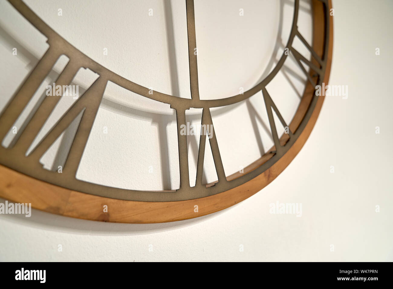 Modern metal and wood wall watch Stock Photo - Alamy
