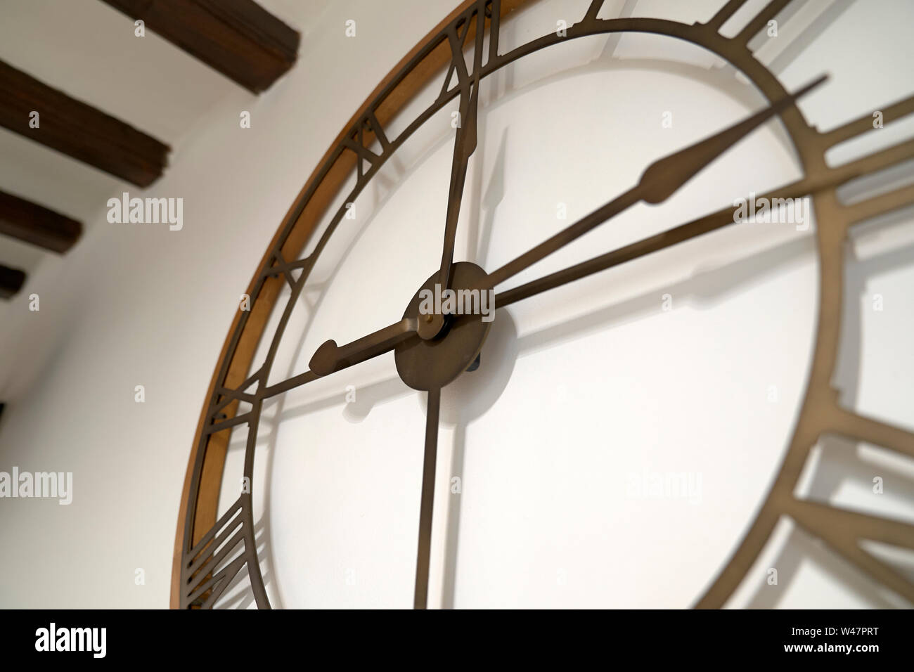 Modern metal and wood wall watch Stock Photo - Alamy