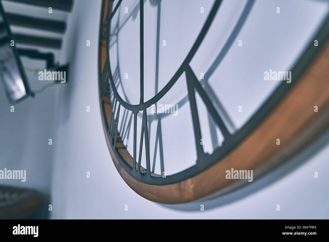 Modern metal and wood wall watch Stock Photo - Alamy