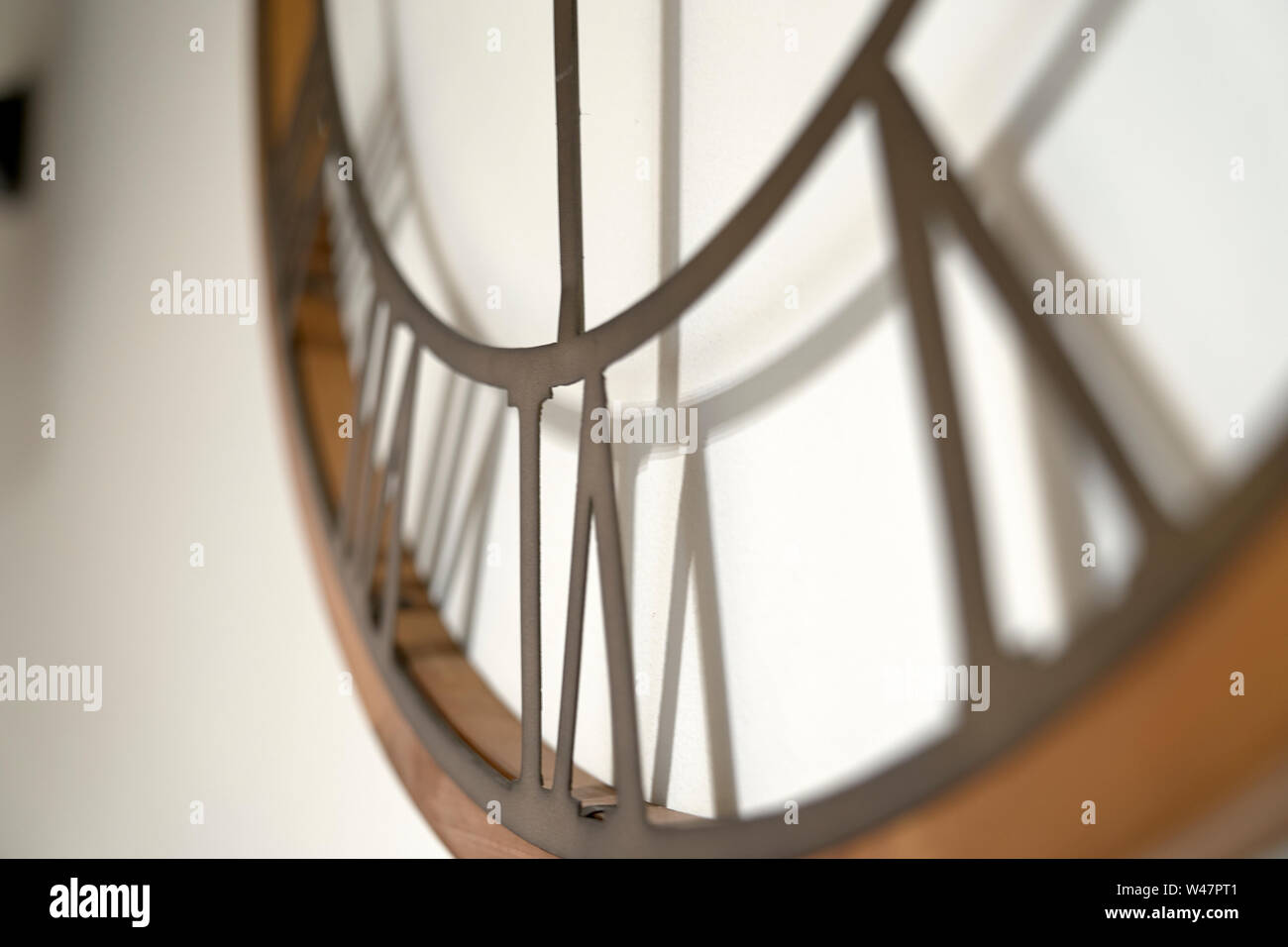Modern metal and wood wall watch Stock Photo - Alamy