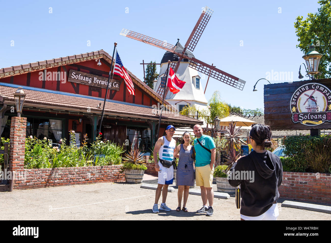 Tourists pose for pictures outside the Solvang Brewing company ...