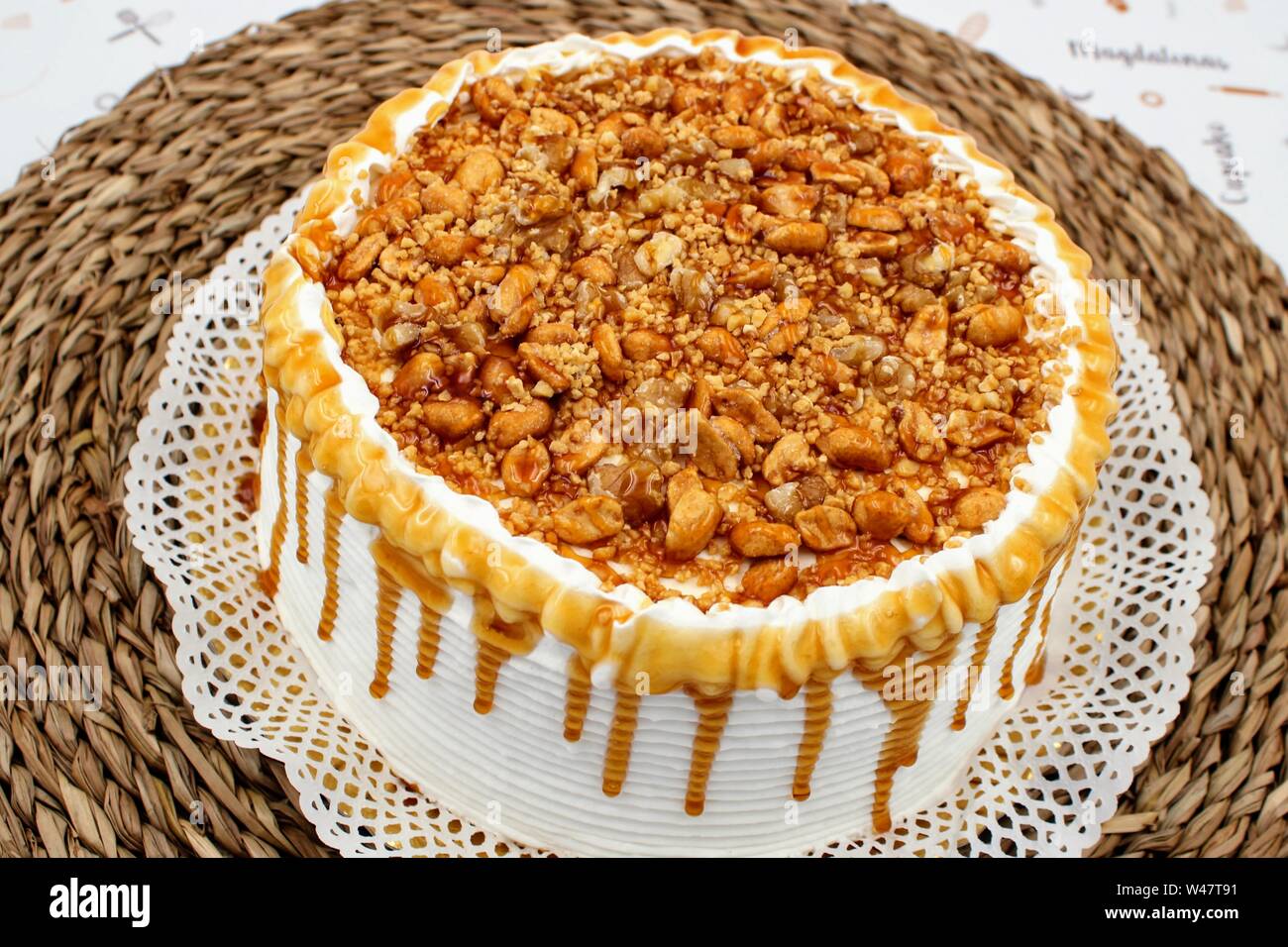 Cream cake with caramel syrup decoration and crispy peanuts Stock Photo ...
