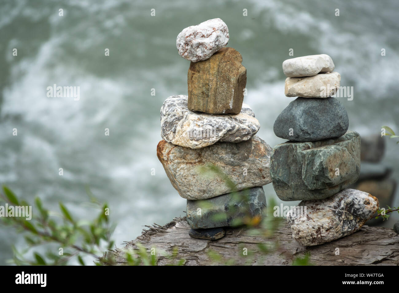 Balancing stones in equilibrium. Meditation and rest on the bank of the ...