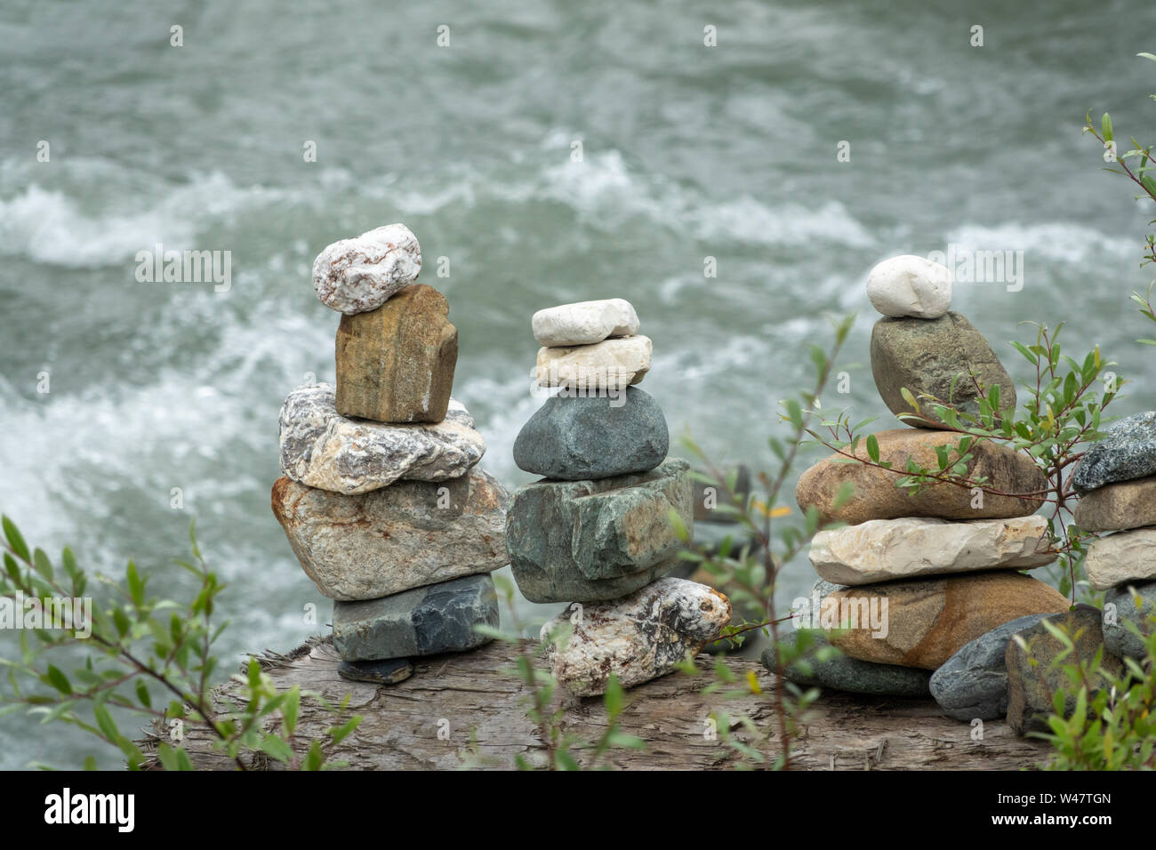 Balancing stones in equilibrium. Meditation and rest on the bank of the ...