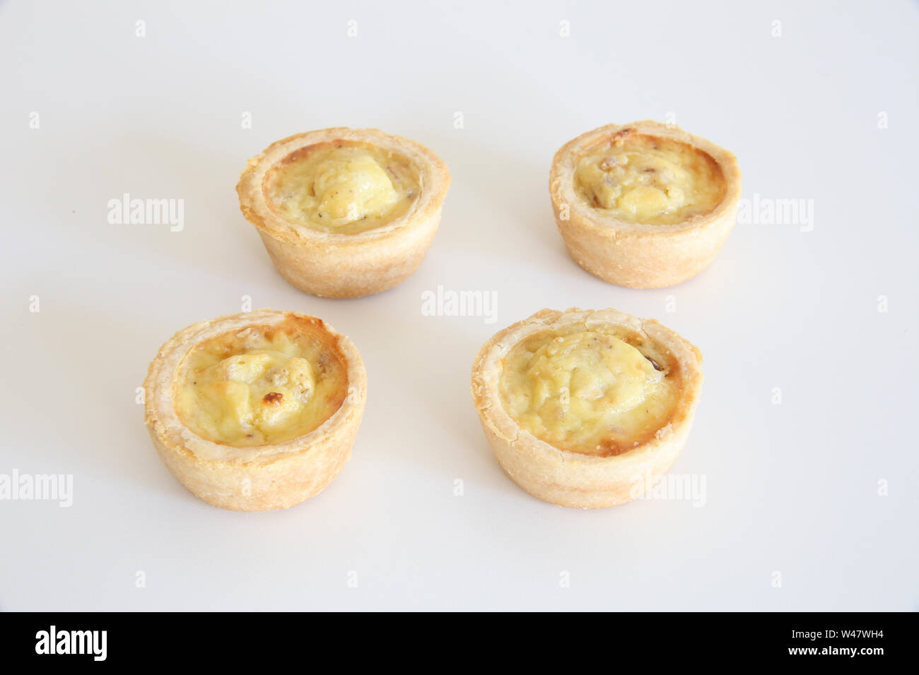 Tasty Mini Quiches Isolated in a White Background Stock Photo - Alamy