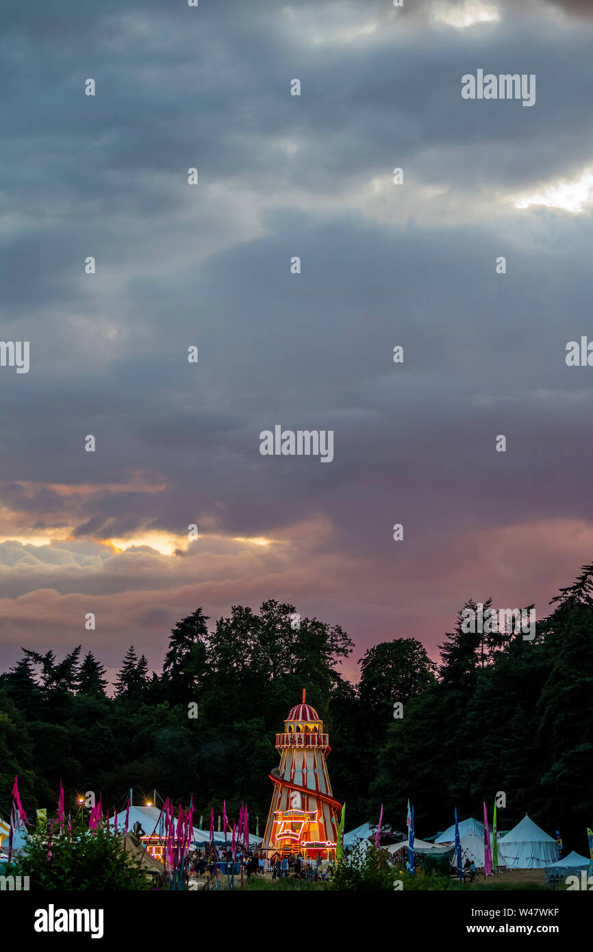 Henham Park, Suffolk, 20 July 2019. Dusk falls over the arena and the ...