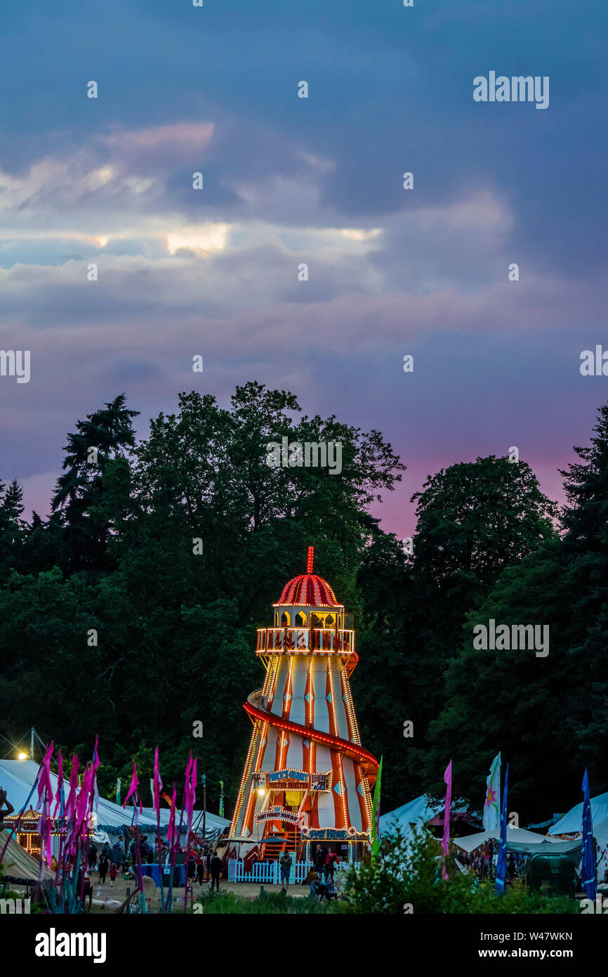 Henham Park, Suffolk, 20 July 2019. Dusk falls over the arena and the ...
