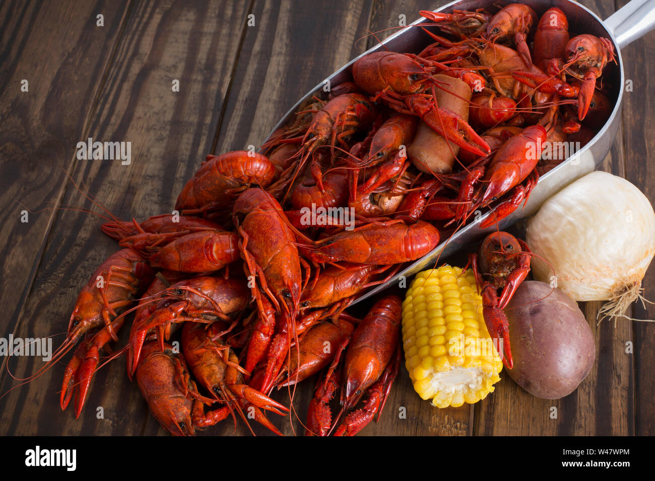 Boiled Crawfish on a Wood Background Stock Photo - Alamy