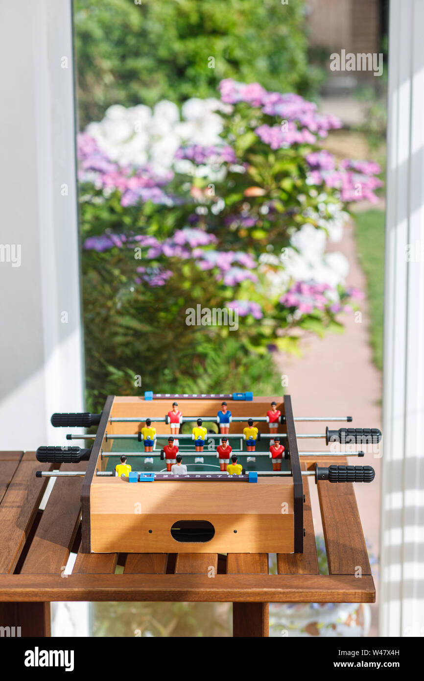 Small Table Football Game in Game Room Stock Photo - Alamy