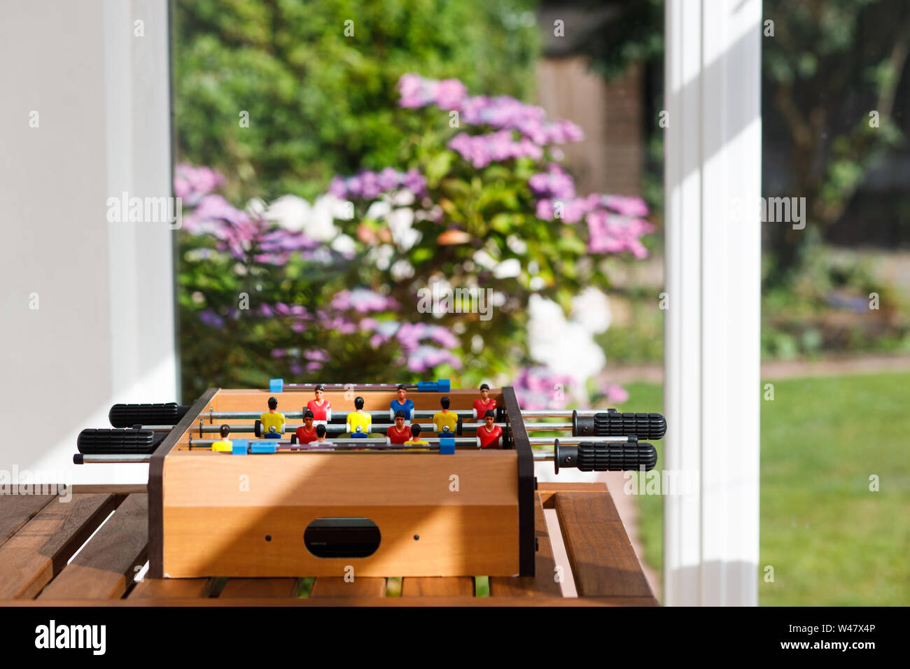 Small Table Football Game in Game Room Stock Photo - Alamy