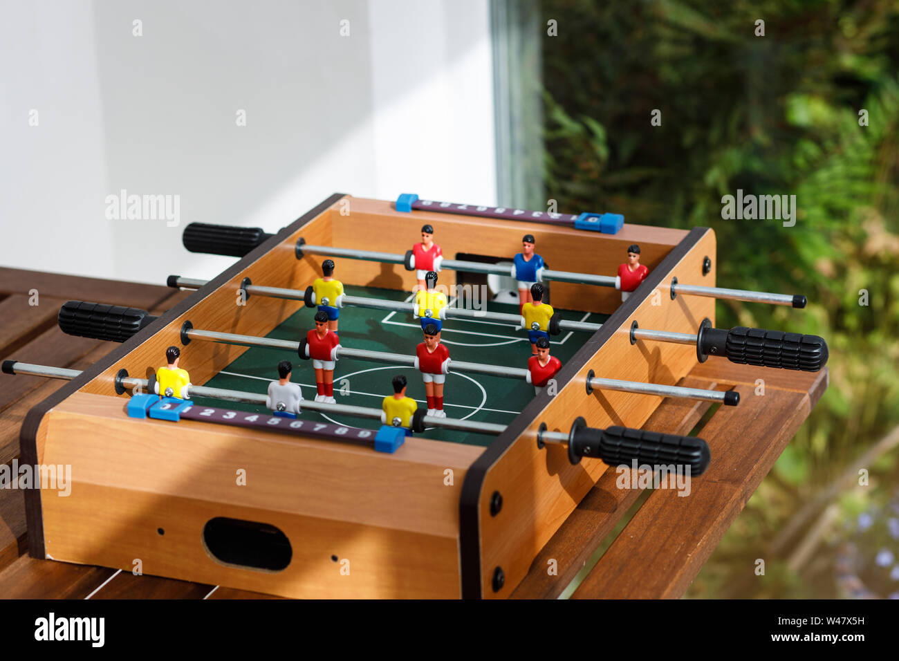 Small Table Football Game in Game Room Stock Photo - Alamy