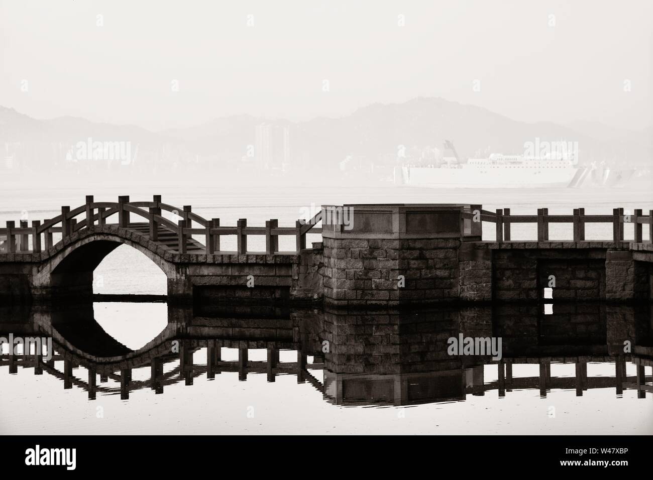 Bridge in Shu Zhuang Garden with traditional Chinese architecture in ...