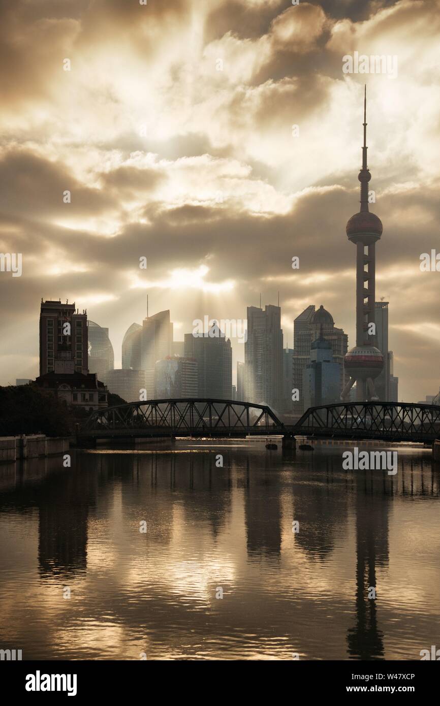 Shanghai morning with sunny sky and water reflections in China Stock ...