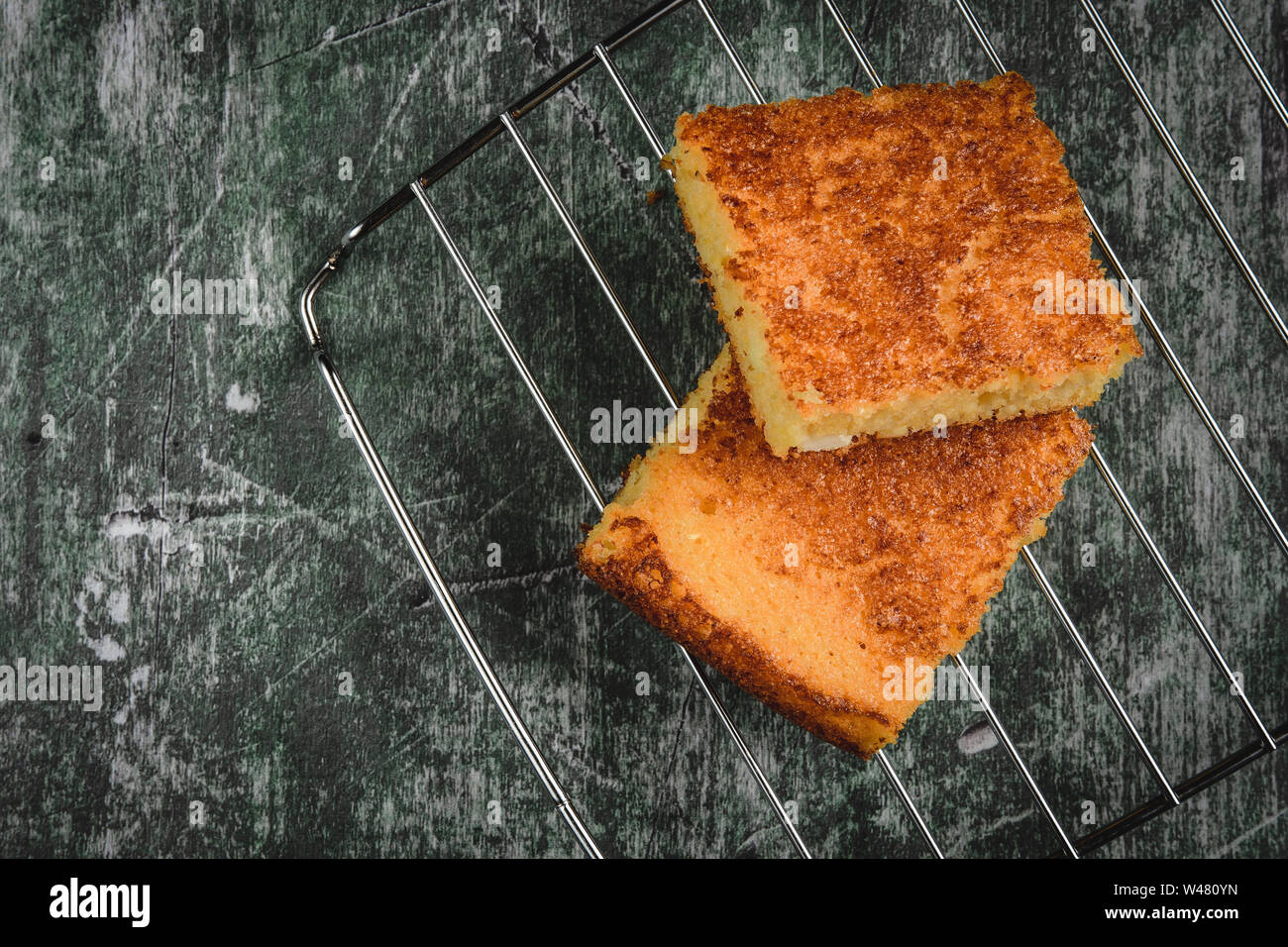 Yellow Corn Bread Squares Slices on Dark Rustic Background Stock Photo ...