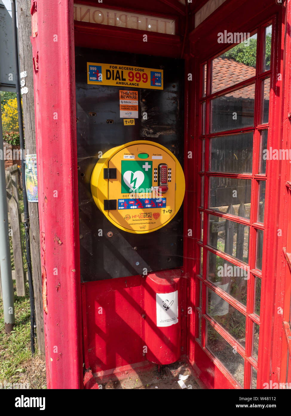 The inside of a traditional red phone box which has been converted into ...