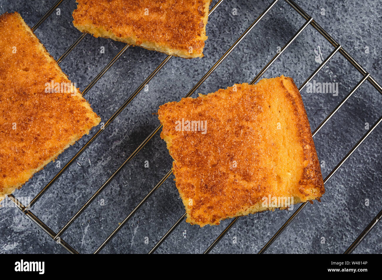 Yellow Corn Bread Squares Slices on Dark Rustic Background Stock Photo ...