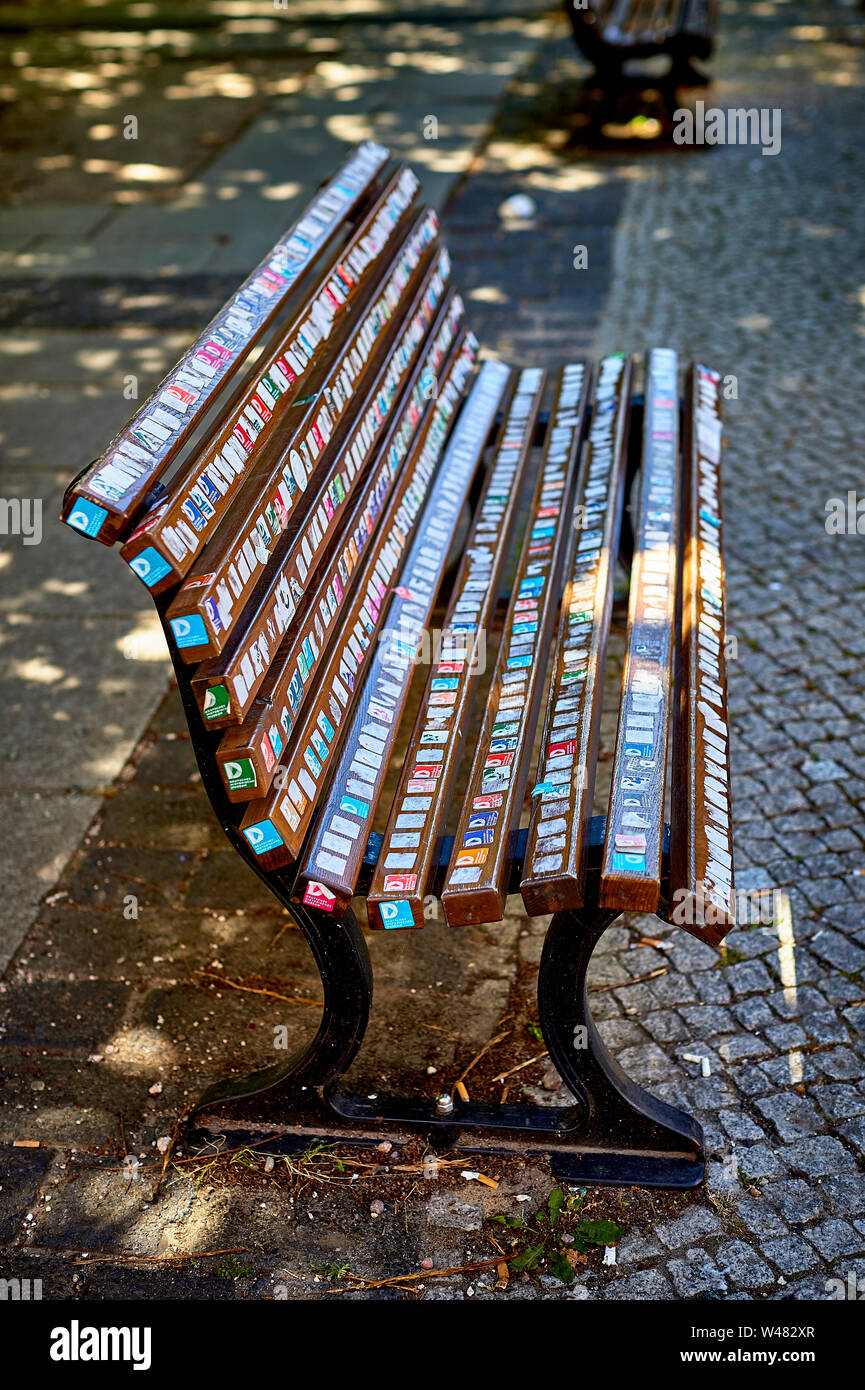 Stickers on a Park bench in Berlin Germany Stock Photo - Alamy