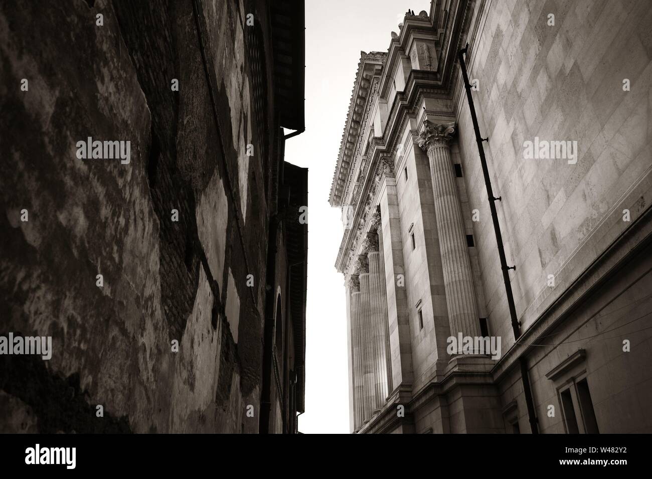 Alley with old buildings and National Monument to Victor Emmanuel II in ...