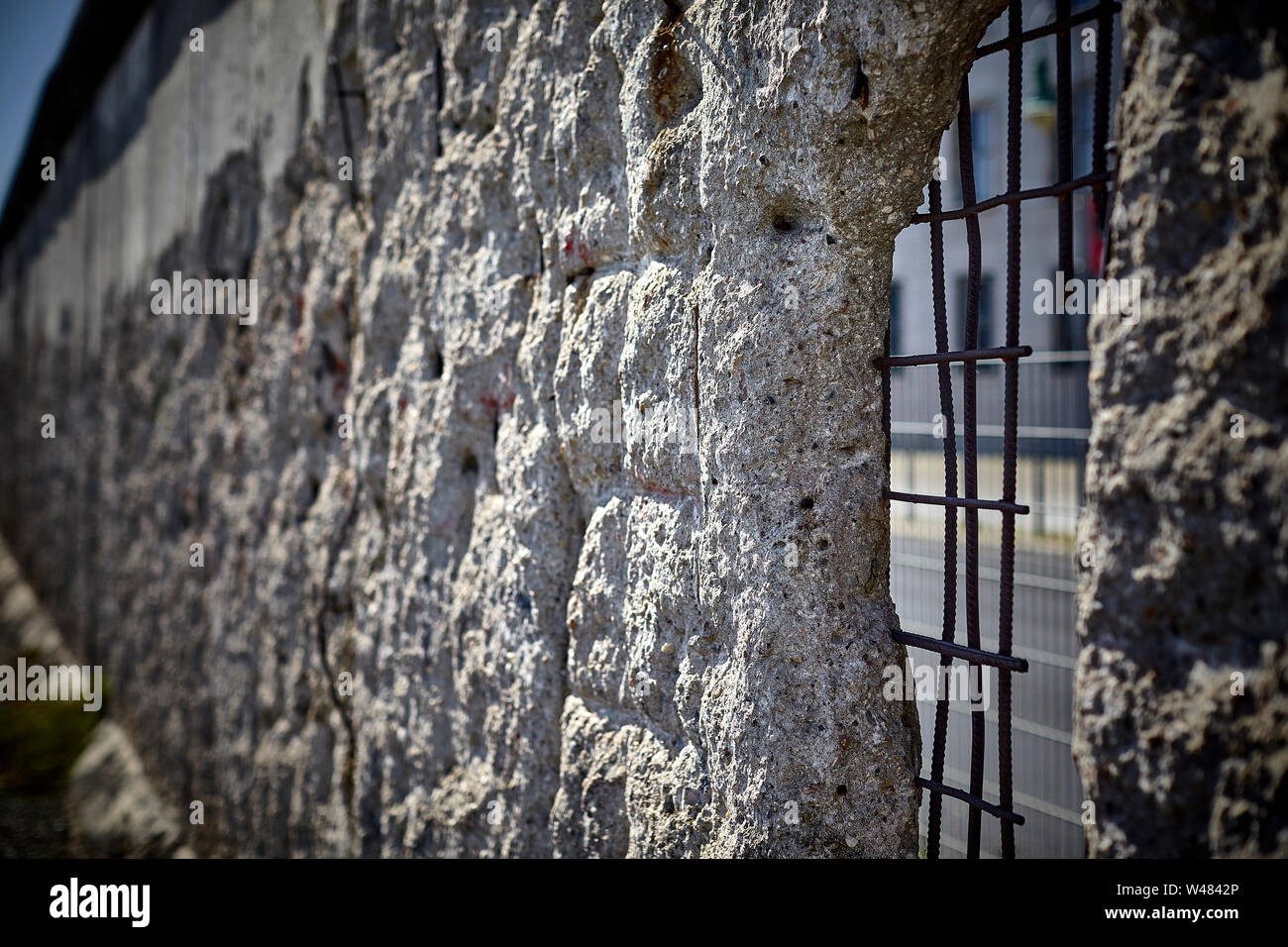 The Berlin Wall was a guarded concrete barrier that physically and ...