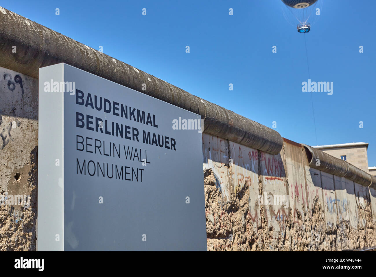 The Berlin Wall was a guarded concrete barrier that physically and ...