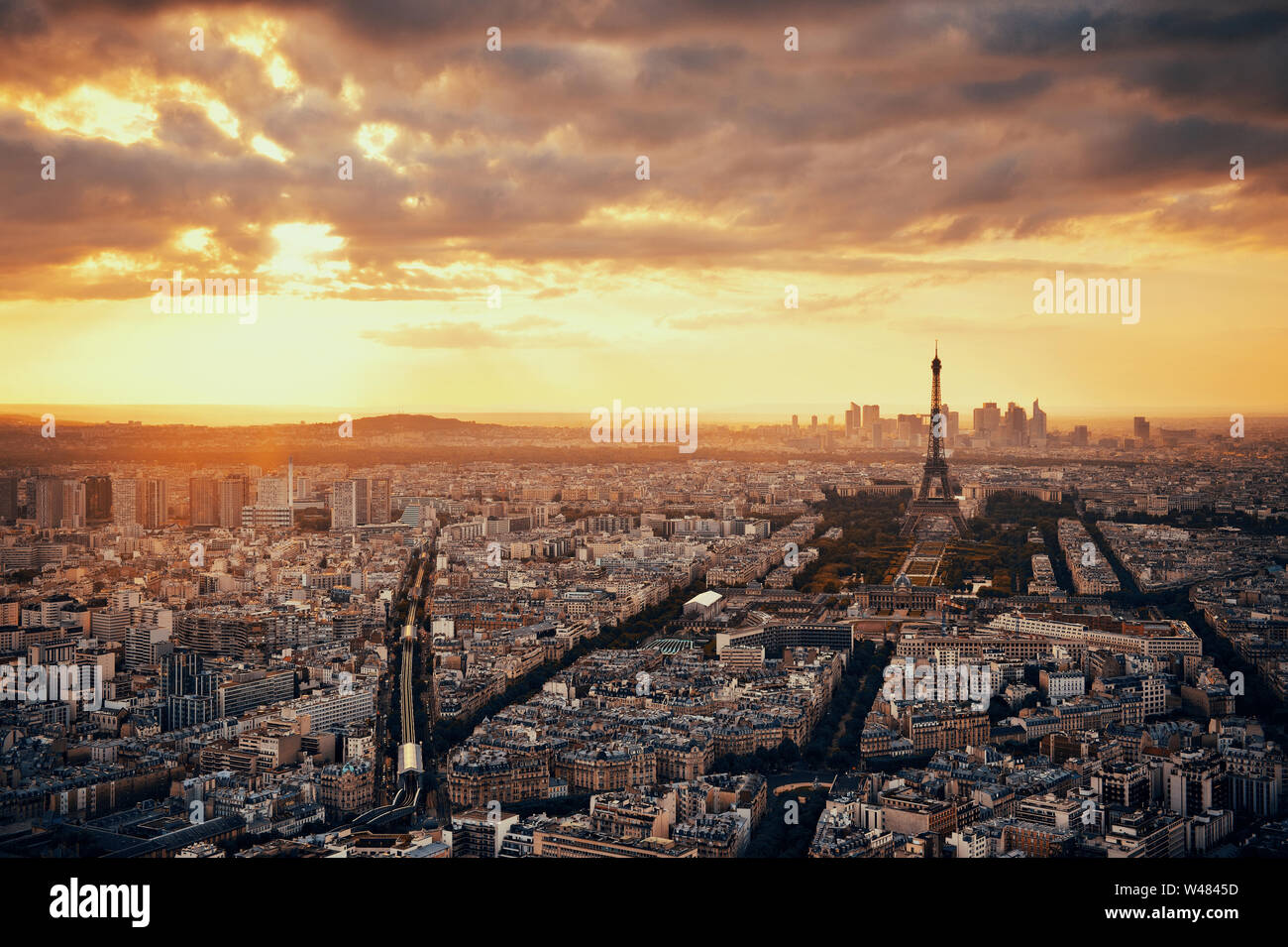 Paris city rooftop view with Eiffel Tower at sunset Stock Photo - Alamy