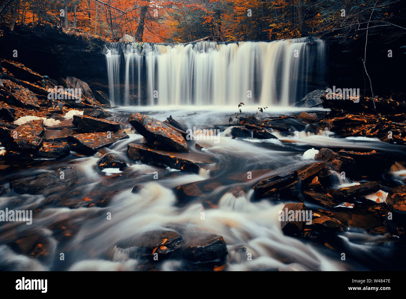 Autumn waterfalls in park with colorful foliage Stock Photo - Alamy