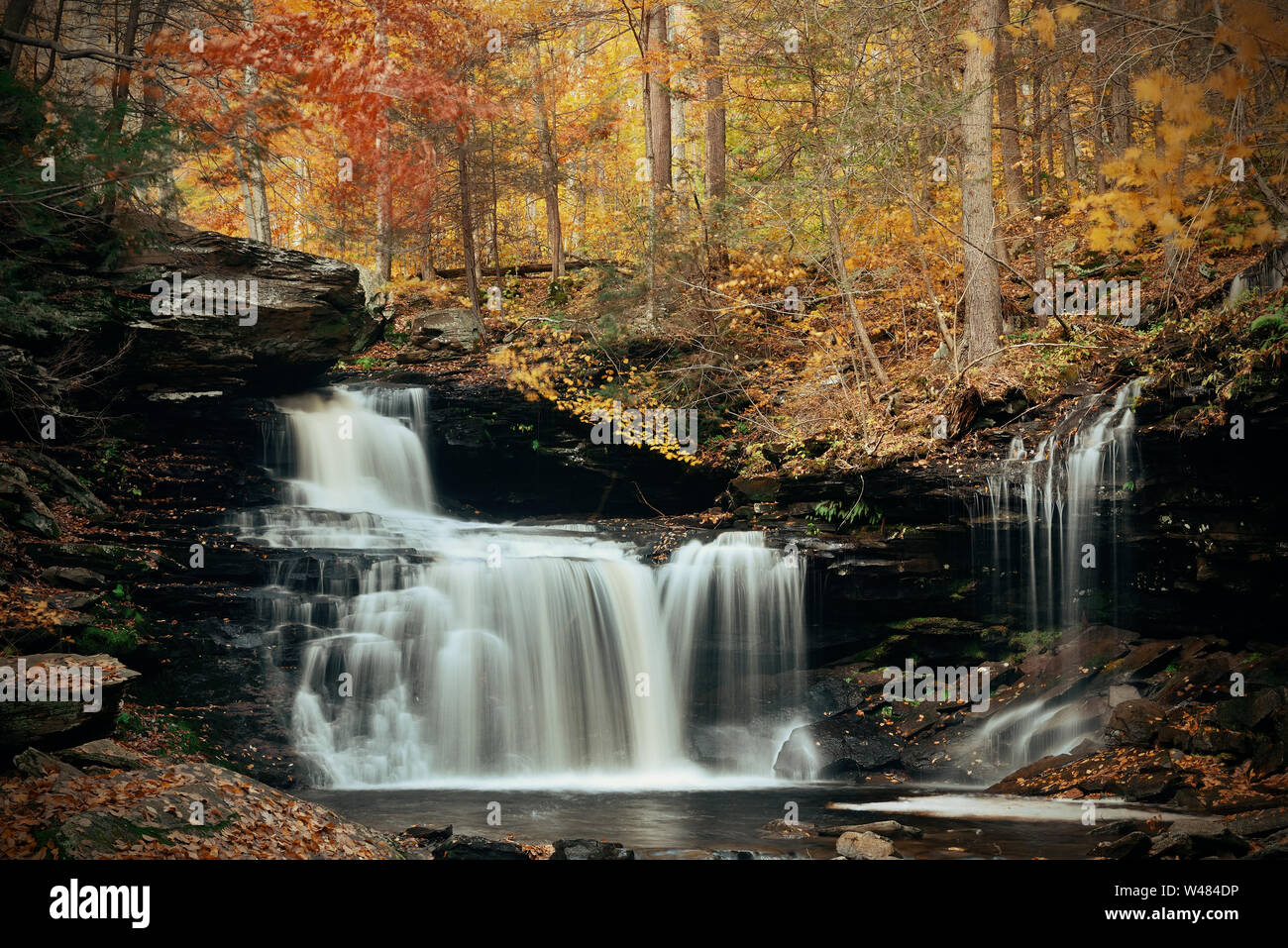 Autumn waterfalls in park with colorful foliage Stock Photo - Alamy