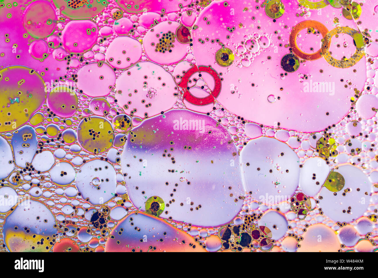Oil bubbles inside water base form patterns Stock Photo - Alamy