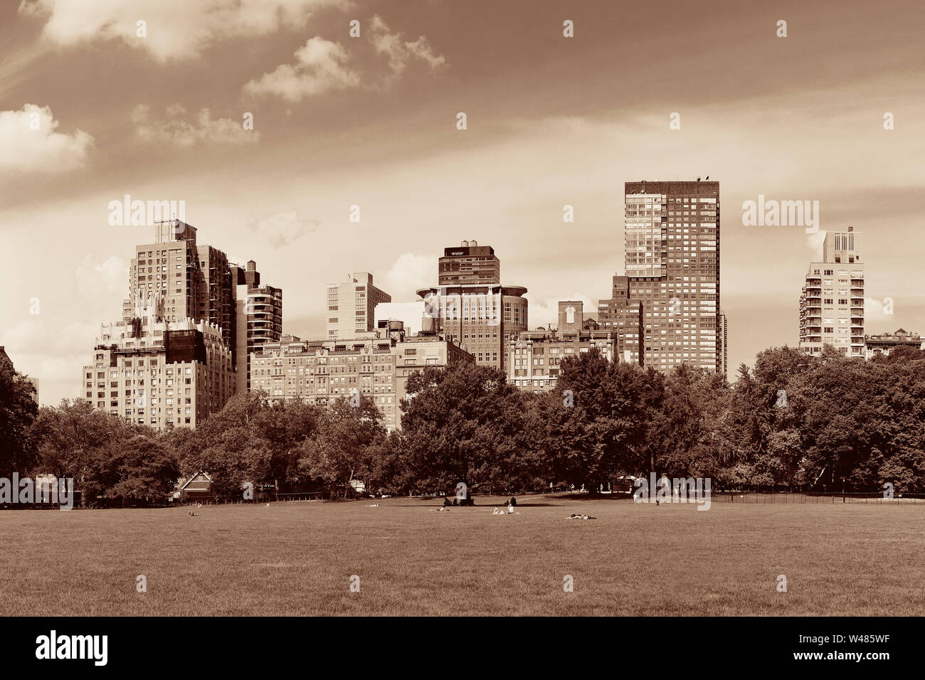 Central Park Spring with skyline in midtown Manhattan New York City ...