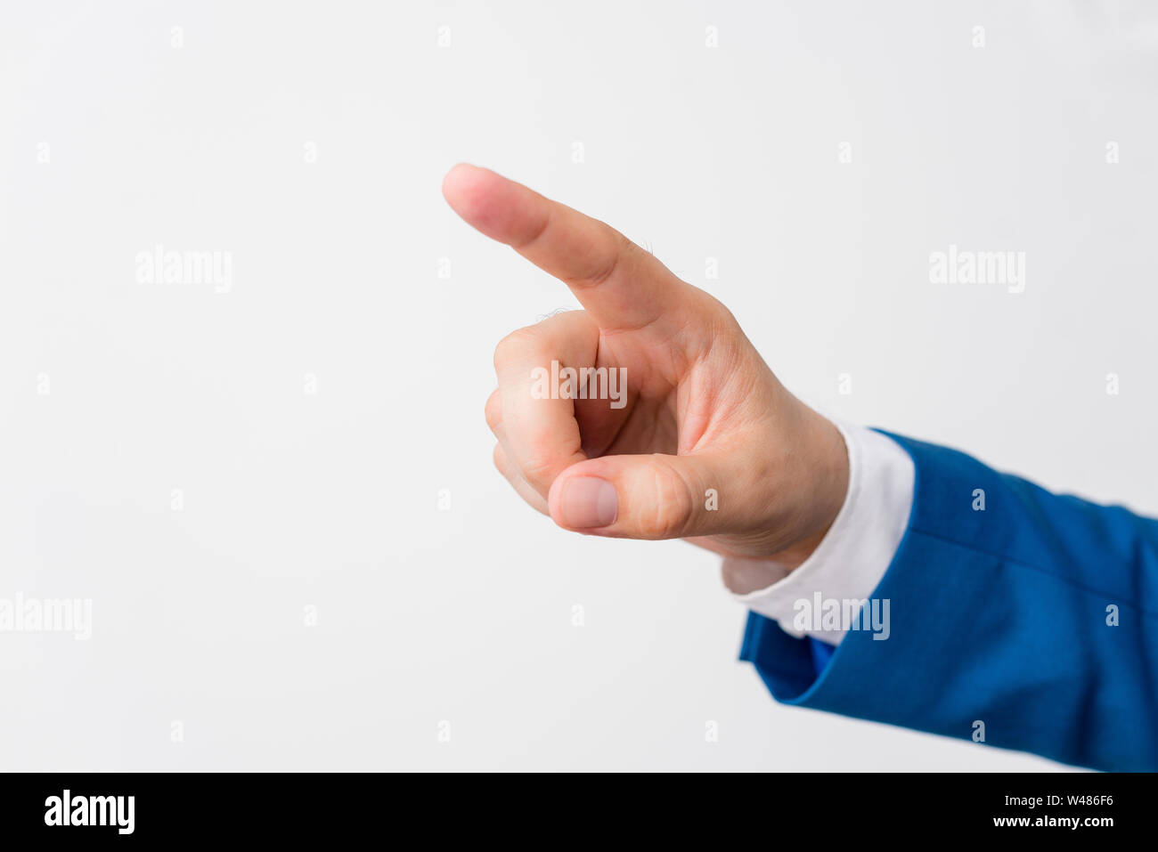 Isolated hand pointing with finger into copy space. Business concept ...