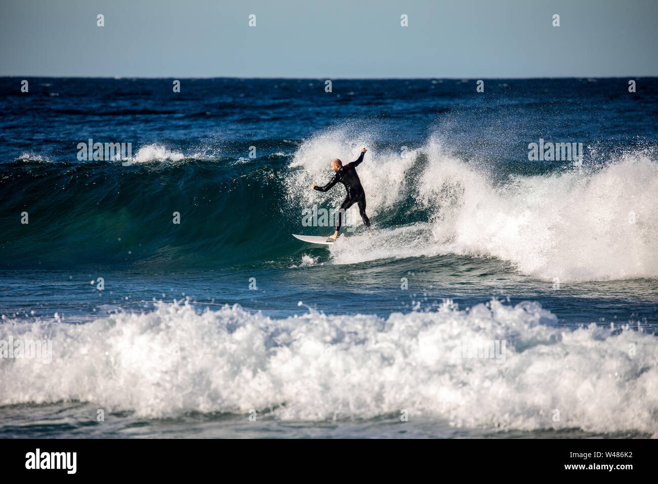 Male surfer on surfboard riding the waves at Avalon beach in Sydney,NSW ...