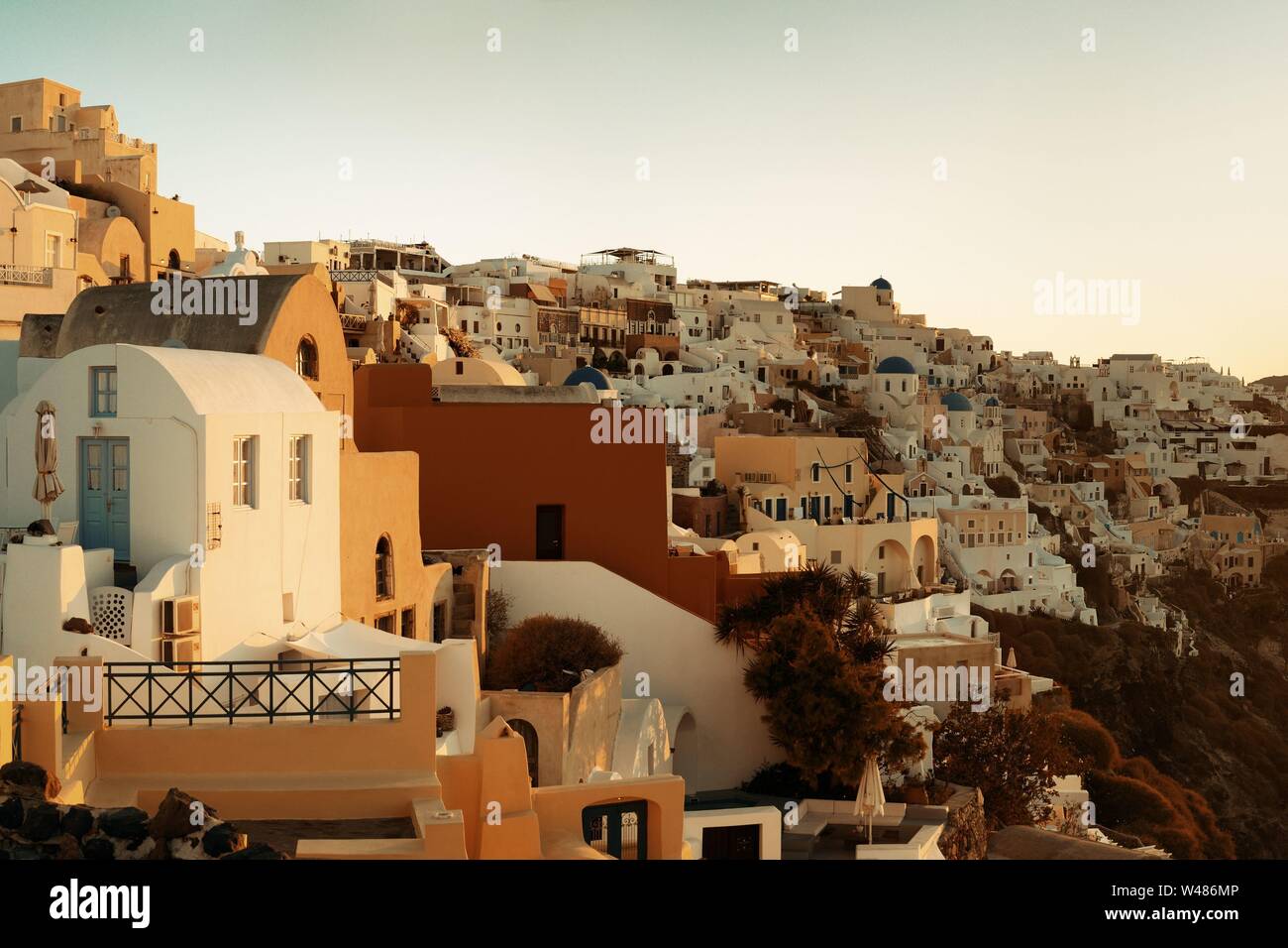 Santorini skyline sunrise with buildings in Greece Stock Photo - Alamy